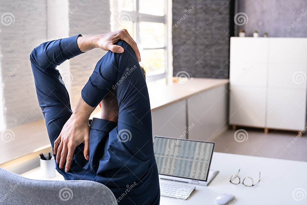 Employee Stretching at Office Desk Stock Image - Image of background ...