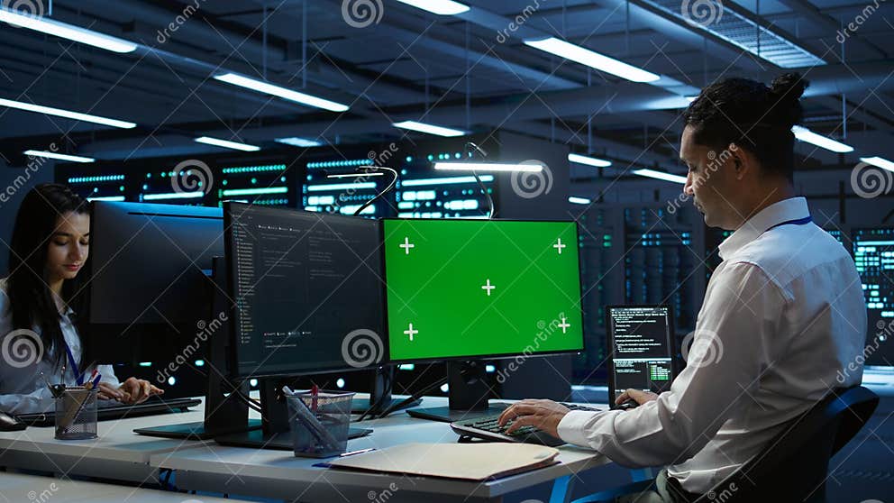 Employee Using Green Screen Devices in Server Farm Used for Automation ... Employee Using Green Screen Devices in Server Farm Used for Automation ...