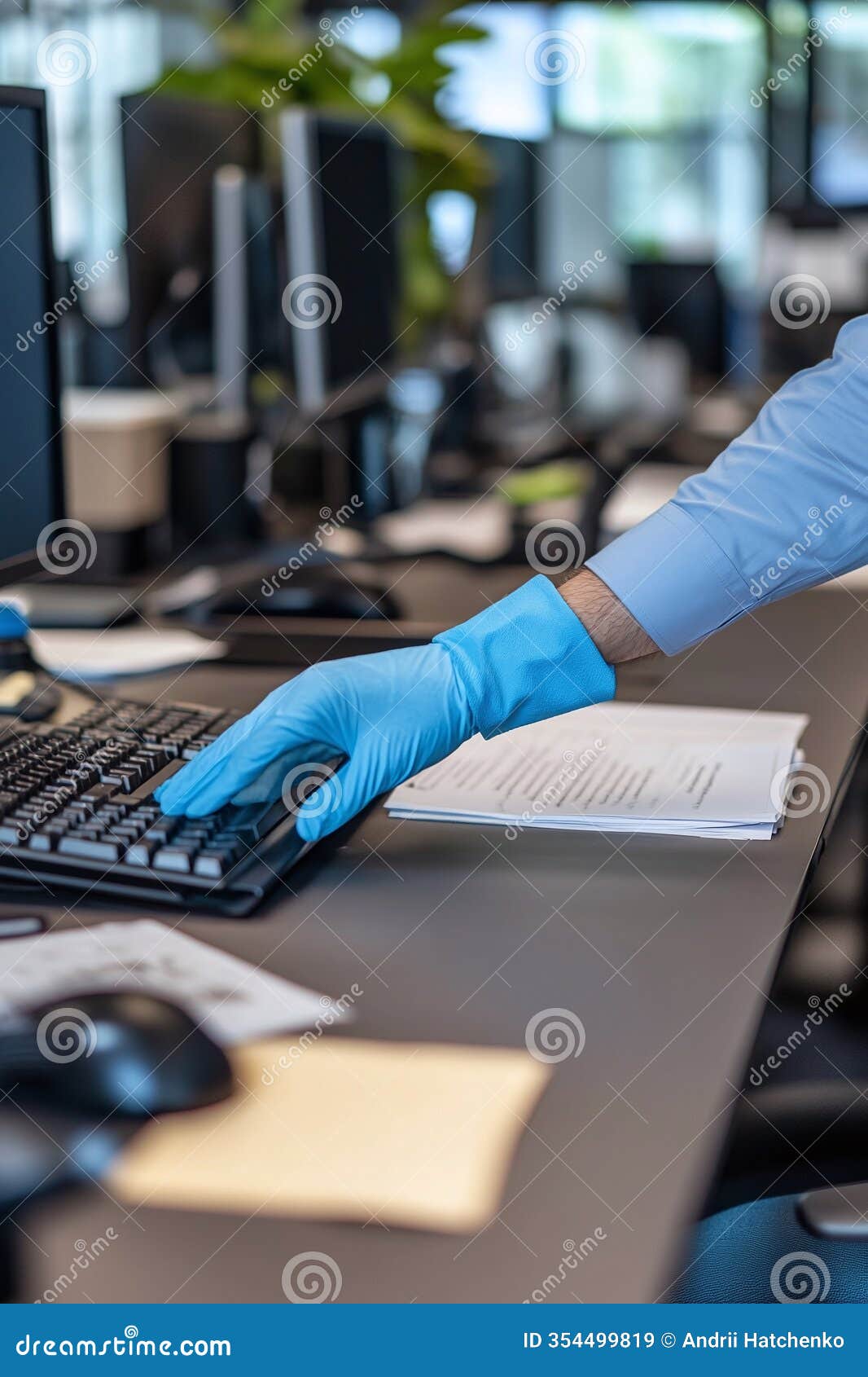 Employee Wiping Down Shared Tools To Maintain Workplace Cleanliness ...