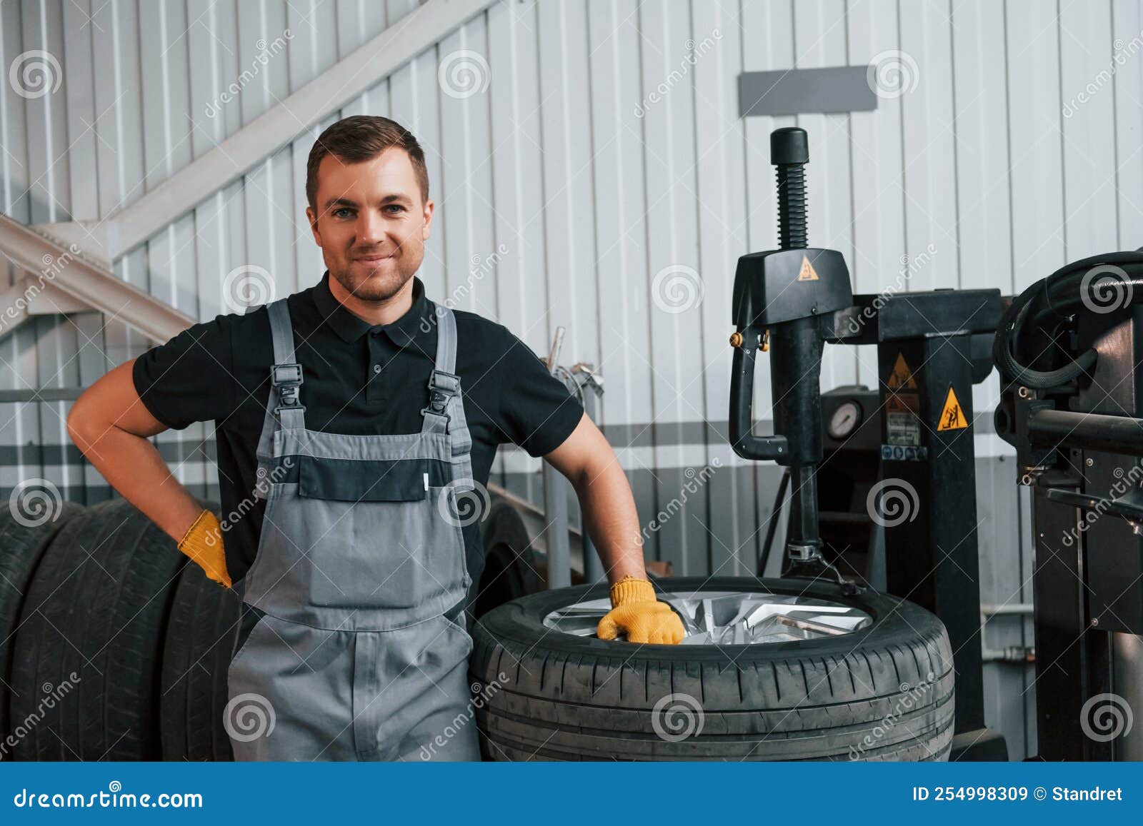 Employee at Work. Man in Uniform is in the Auto Service Stock Image ...