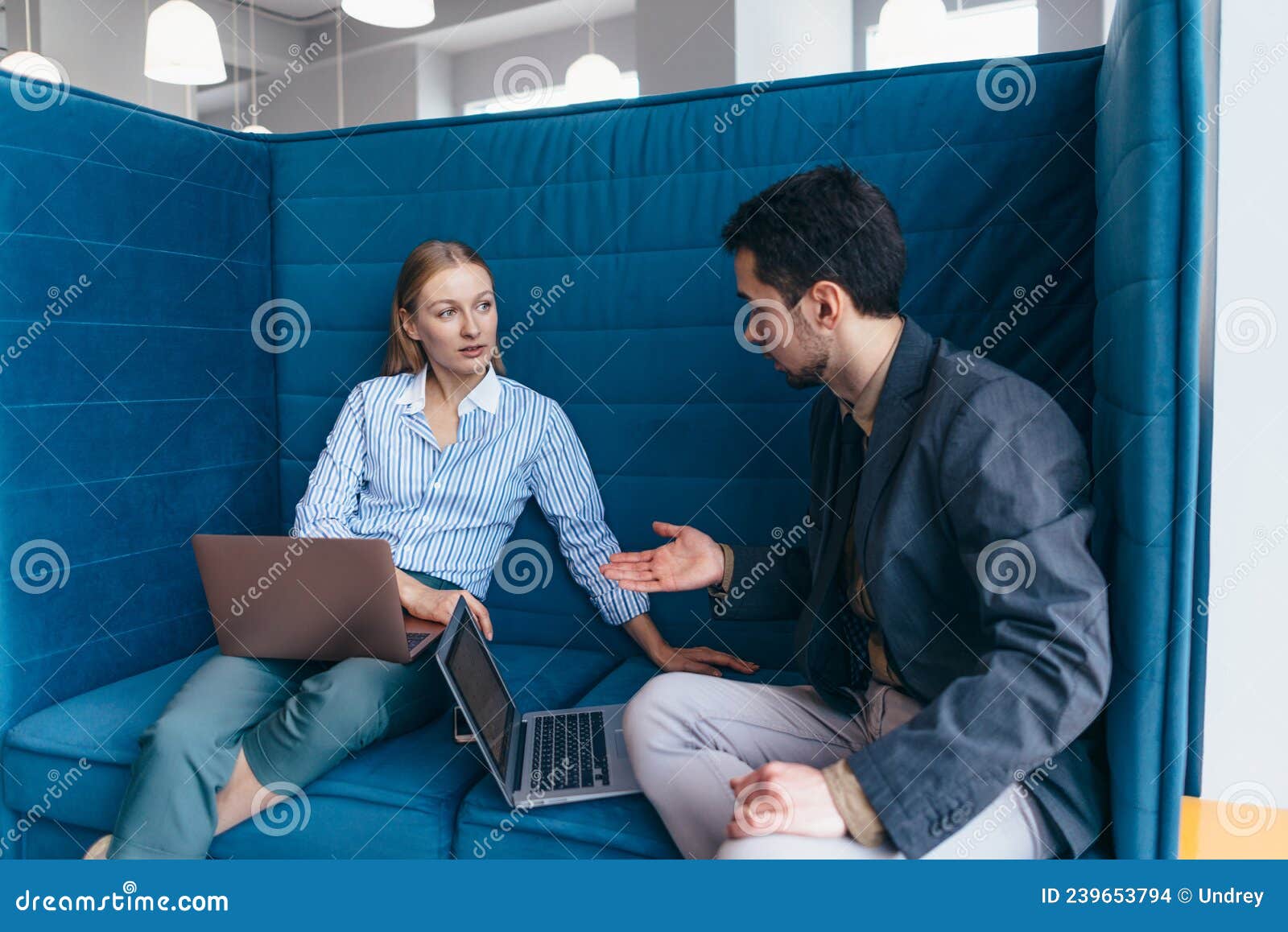 Employees on Break Sitting with Laptops Talking about Business ...