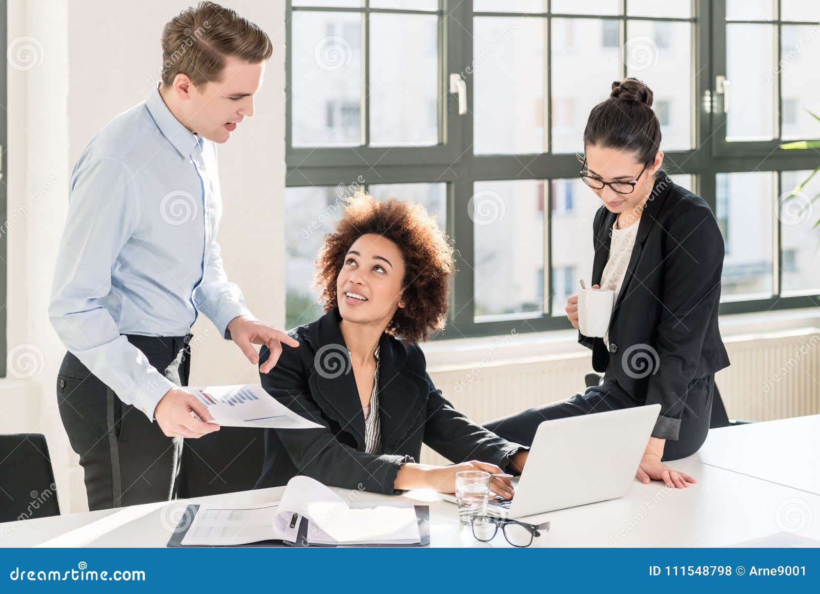 Employees Checking Together Documents and Business Reports Stock Photo ...