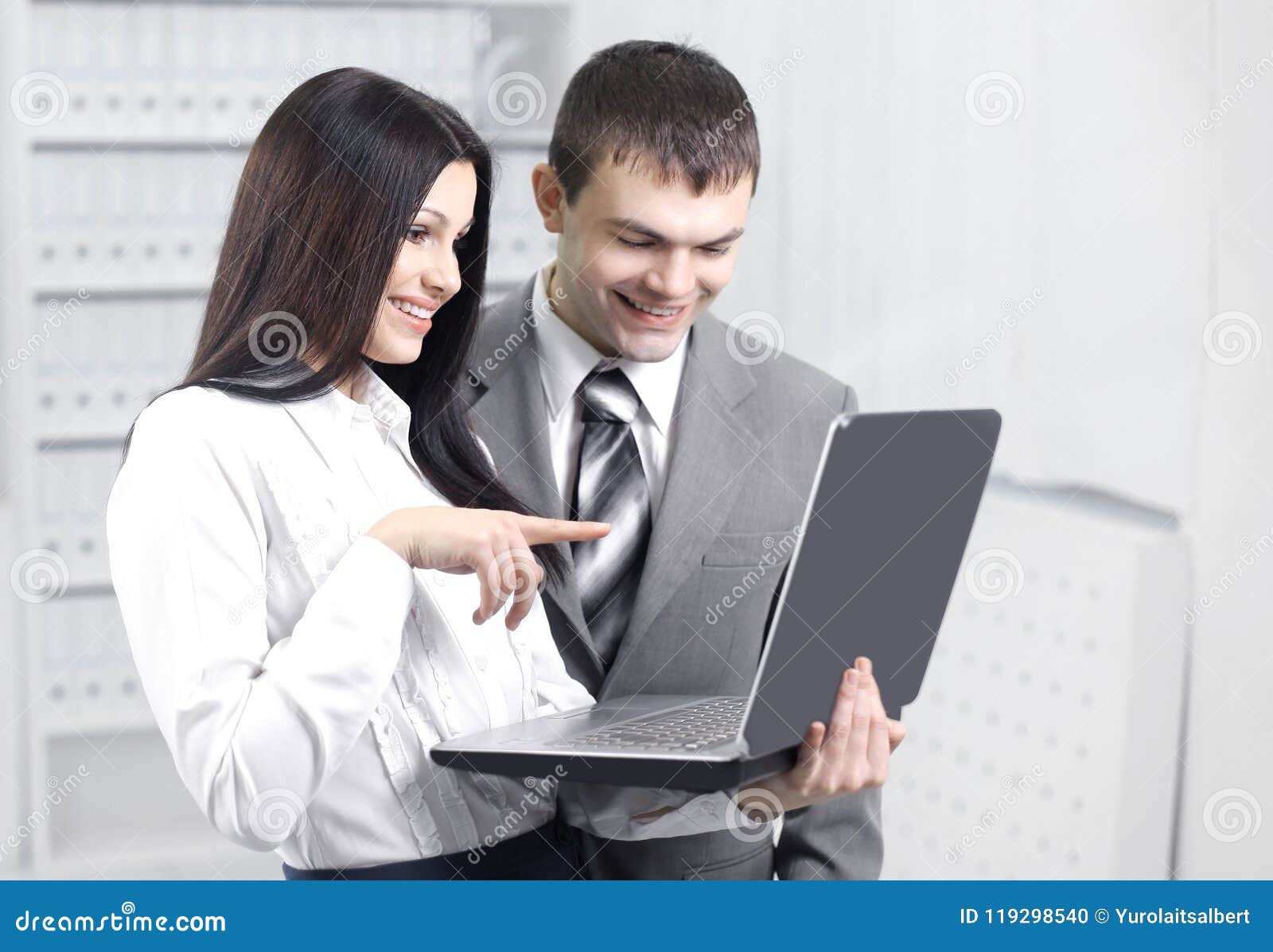 Employees Communicating on the Internet Using Laptop. Stock Photo ...