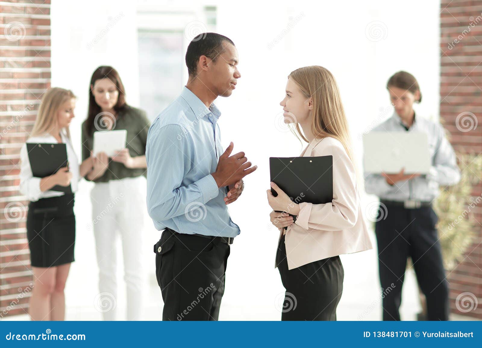 Employees Discussing Business Document Standing in the Office Stock ...