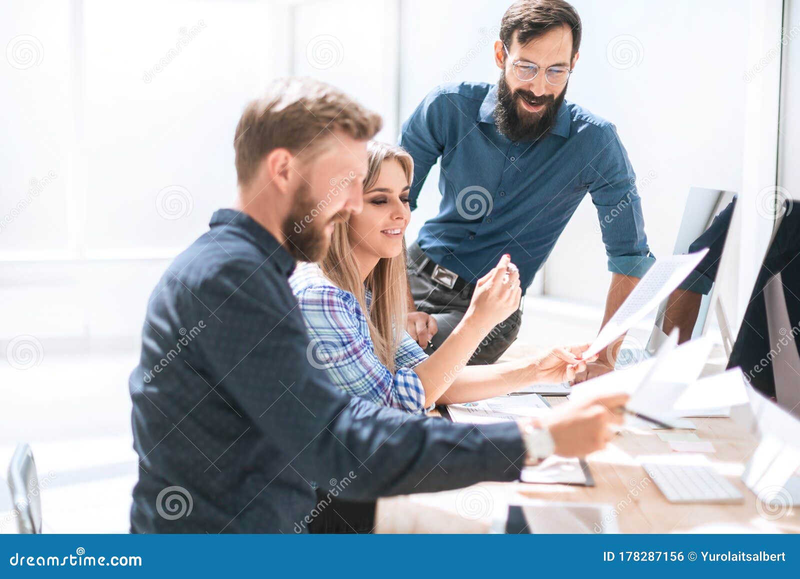 Employees Discussing Documentation for a New Project Stock Photo ...