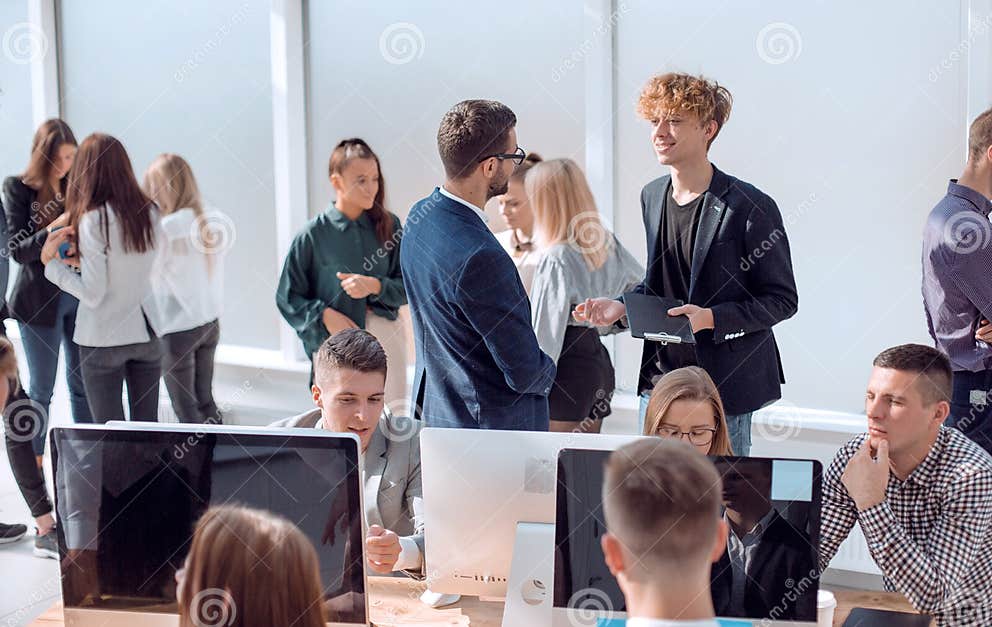 Employees Discussing Work Issues in the Office Stock Photo - Image of ...