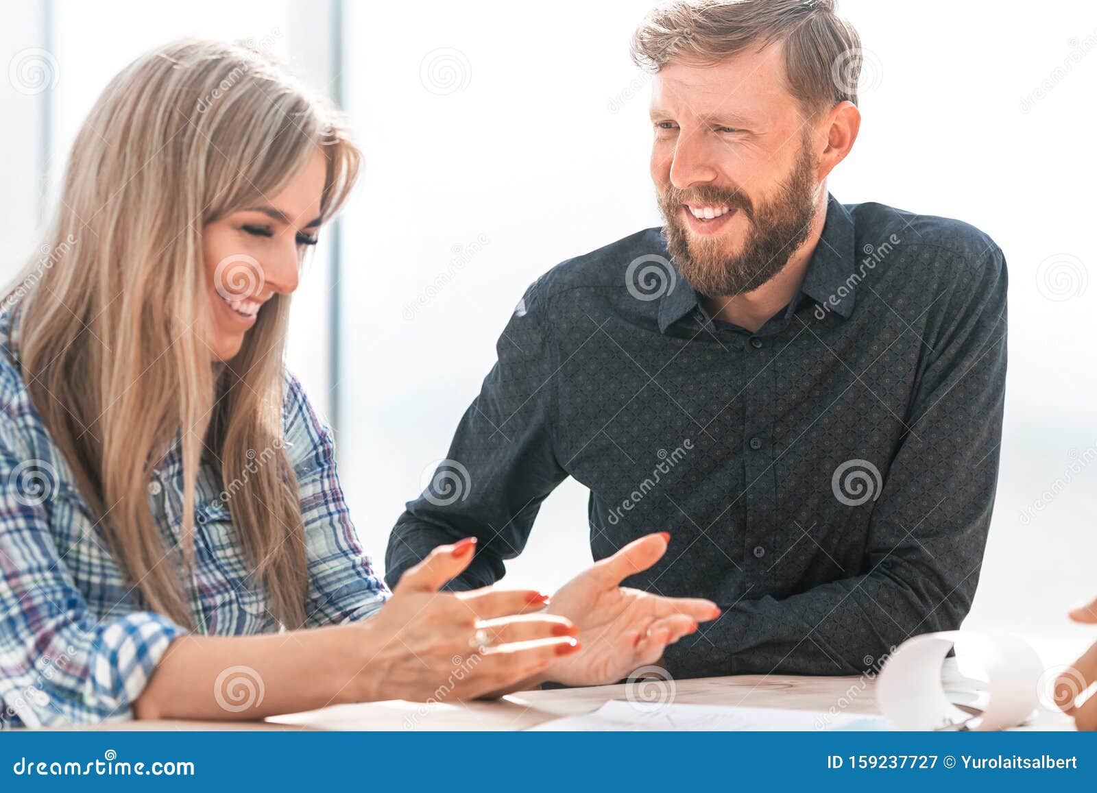 Employees Discussing Working Documents Sitting at the Table Stock Image ...