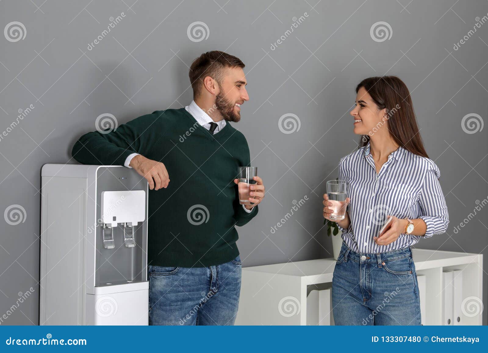 Employees Having Break Near Water Cooler Stock Photo - Image of aqua ...