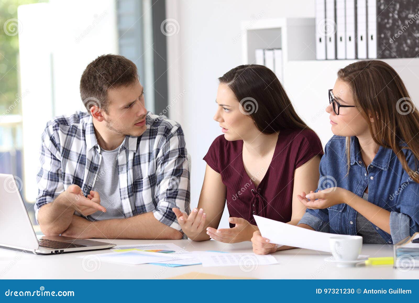 Employees Having a Job Conversation at Office Stock Photo - Image of ...