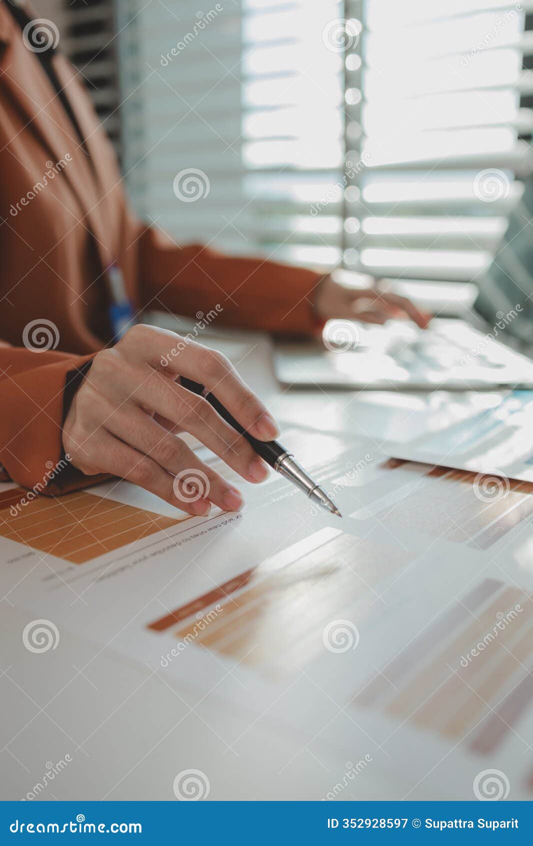 Employees Sit in an Office with a Pile of Documents that Need To Be ...