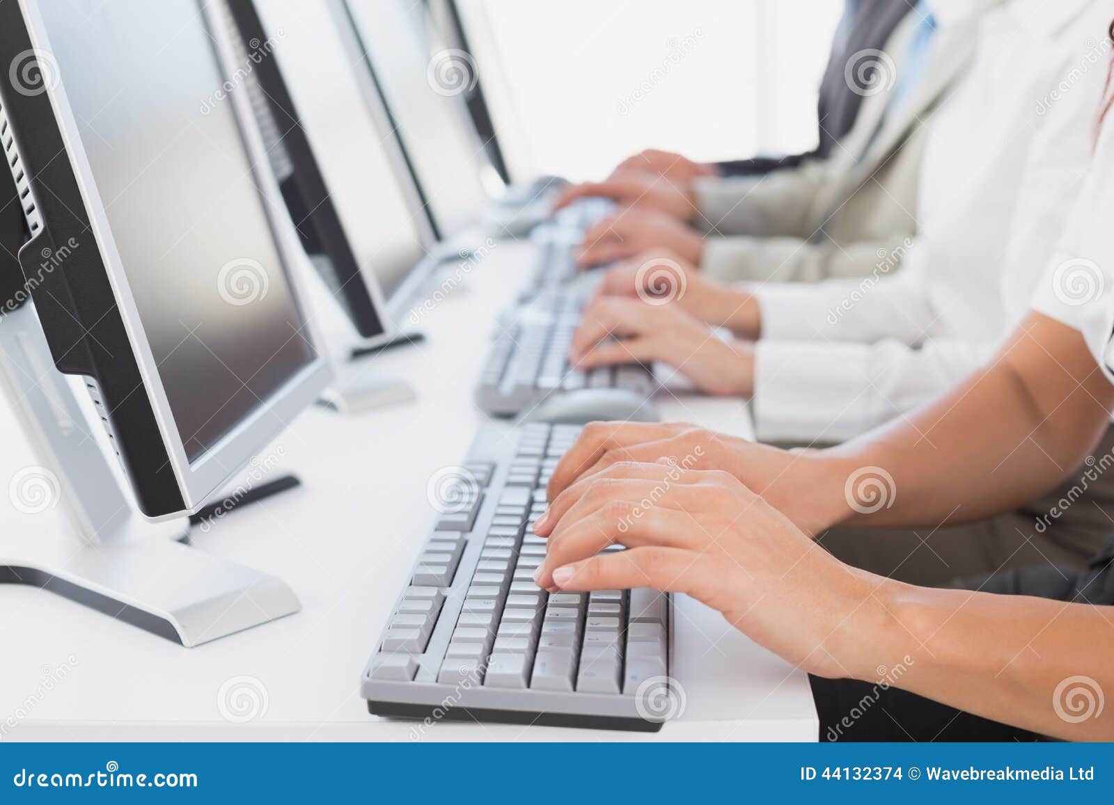 Employees Typing on Their Computers Stock Photo - Image of smiling ...