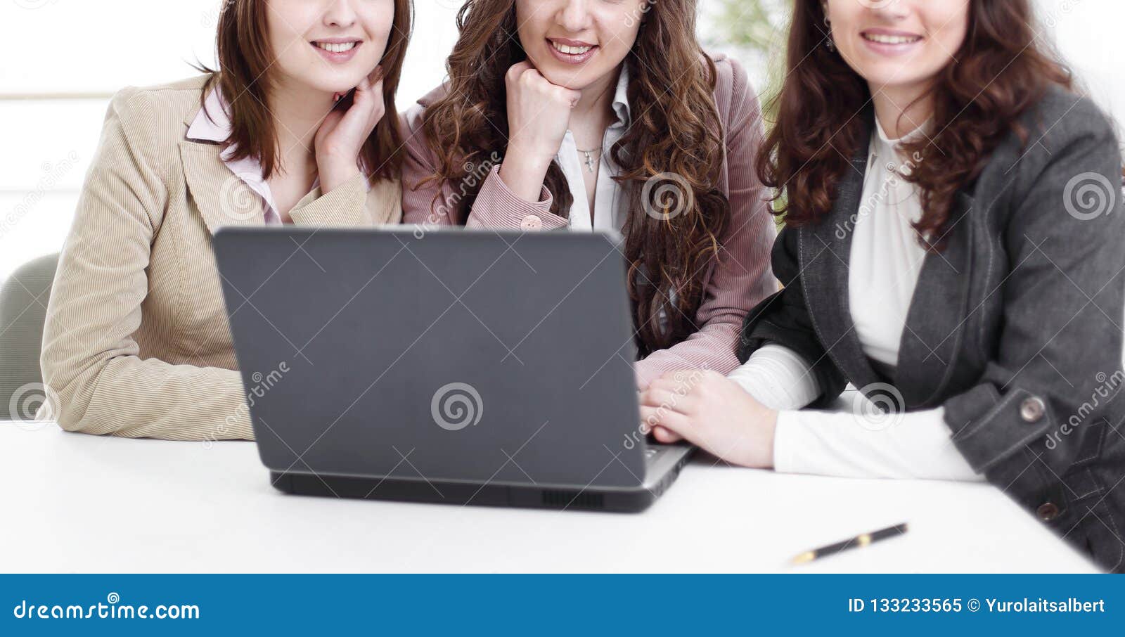 Younger Employees Looking at Laptop Screen in Office. Stock Image ...