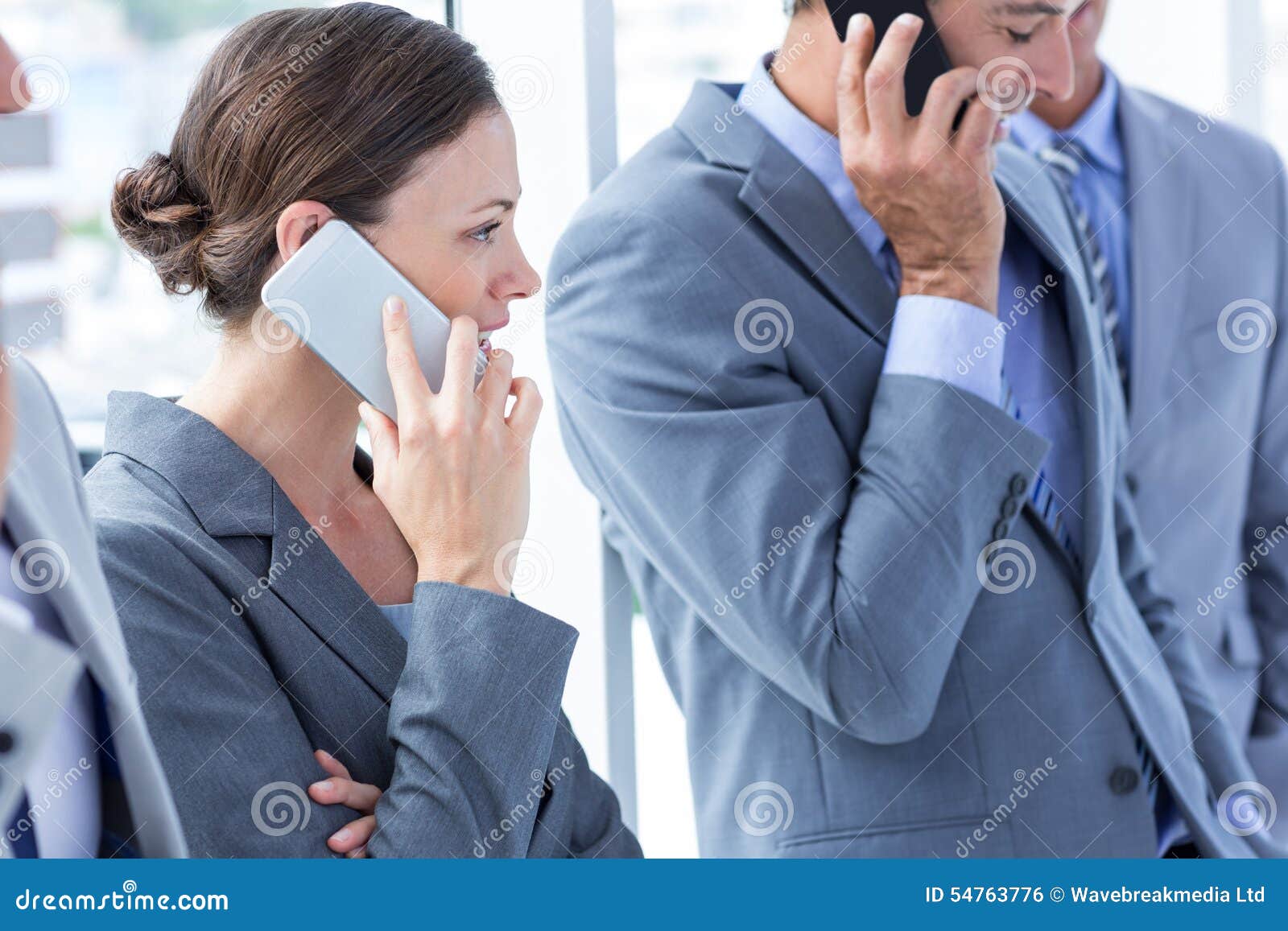 Employees Using Their Mobile Phone Stock Photo - Image of partnership ...