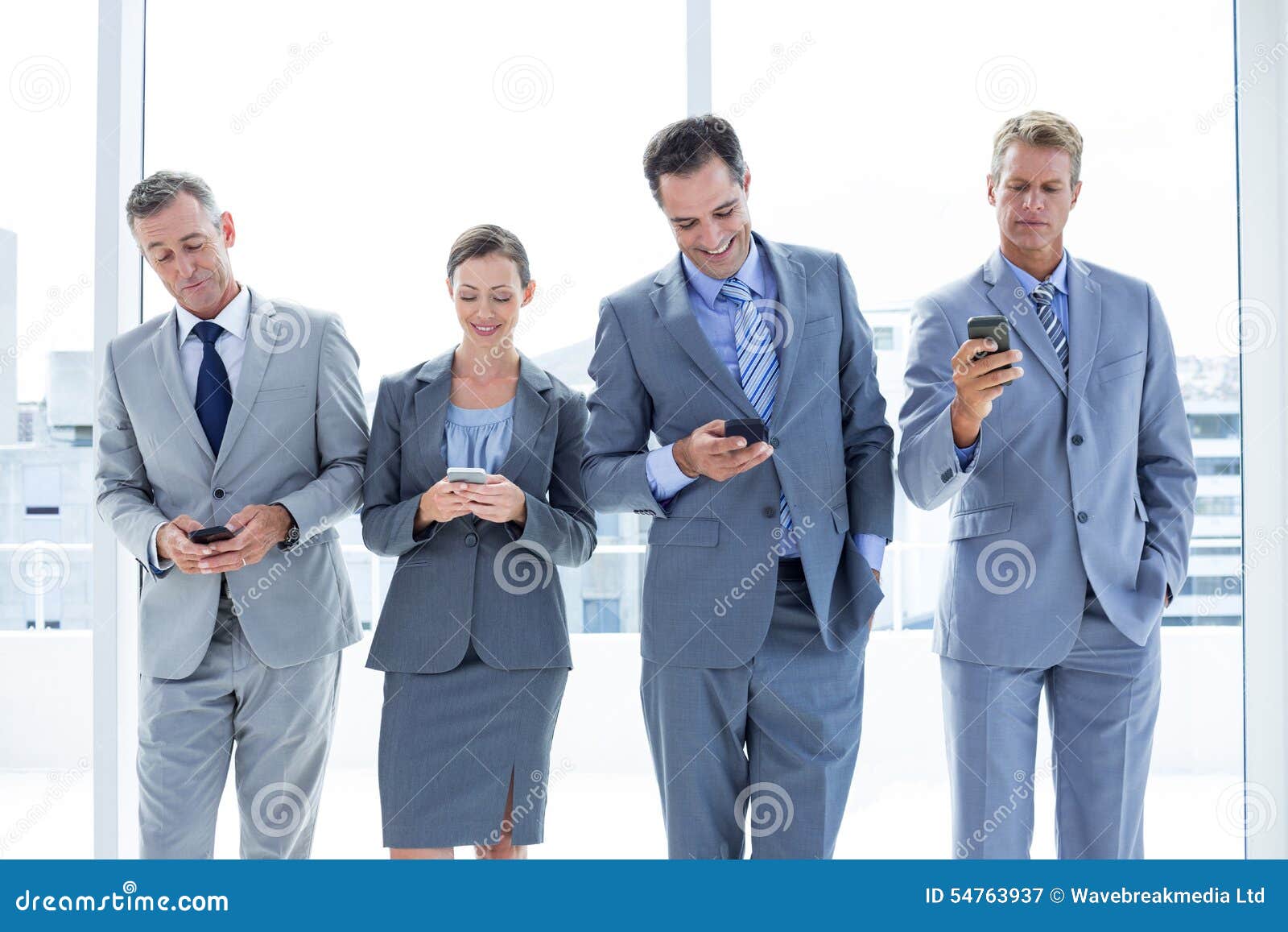 Employees Using Their Mobile Phone Stock Image - Image of dressed, male ...