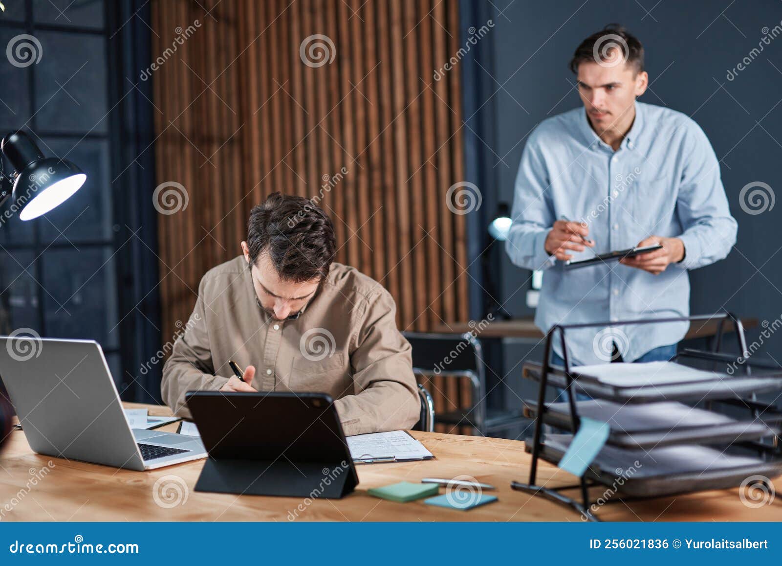 Employees Working with Documents until Late at Night. Stock Photo ...