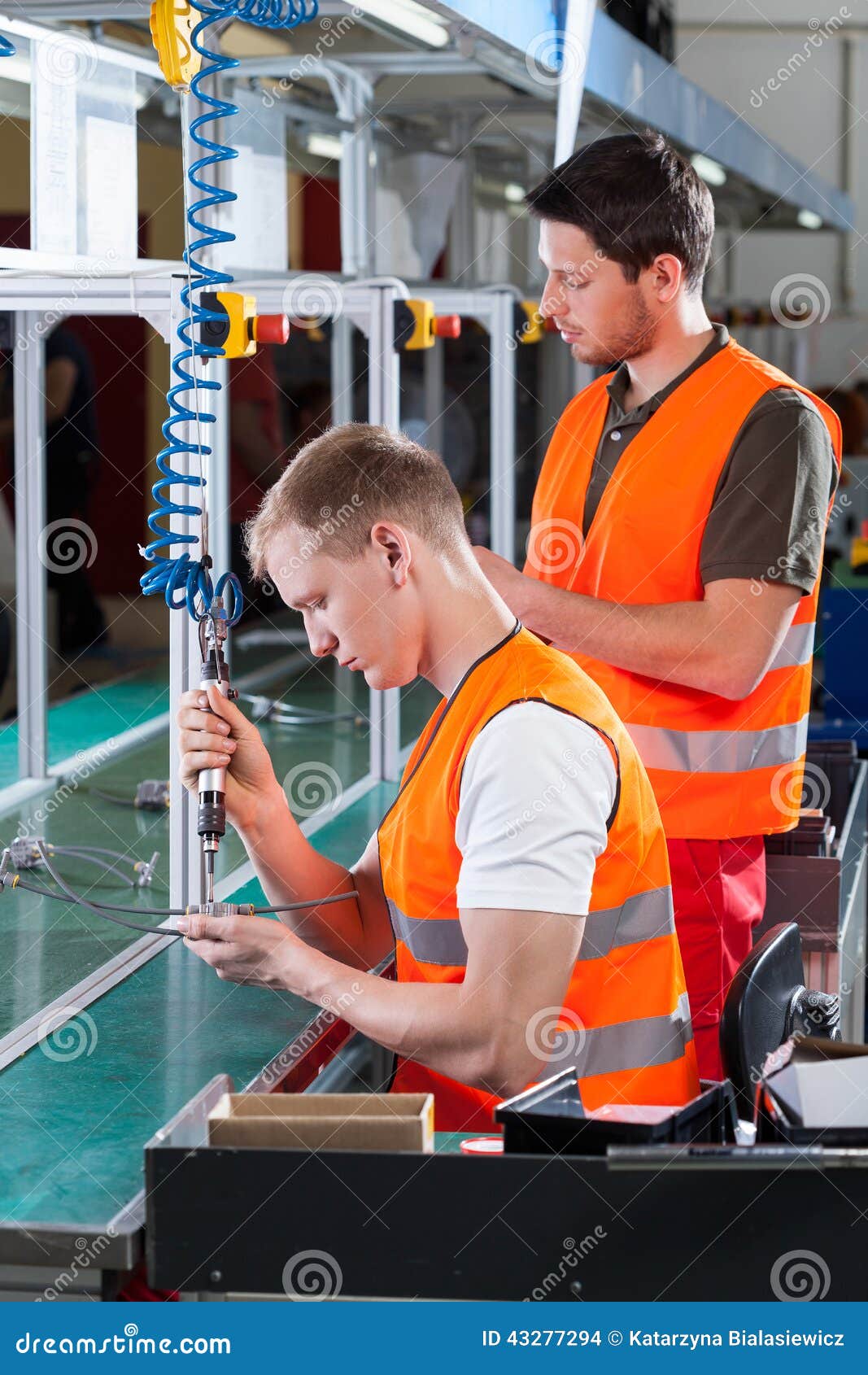 Employees Working Next To Machine Stock Photo - Image of mechanic ...