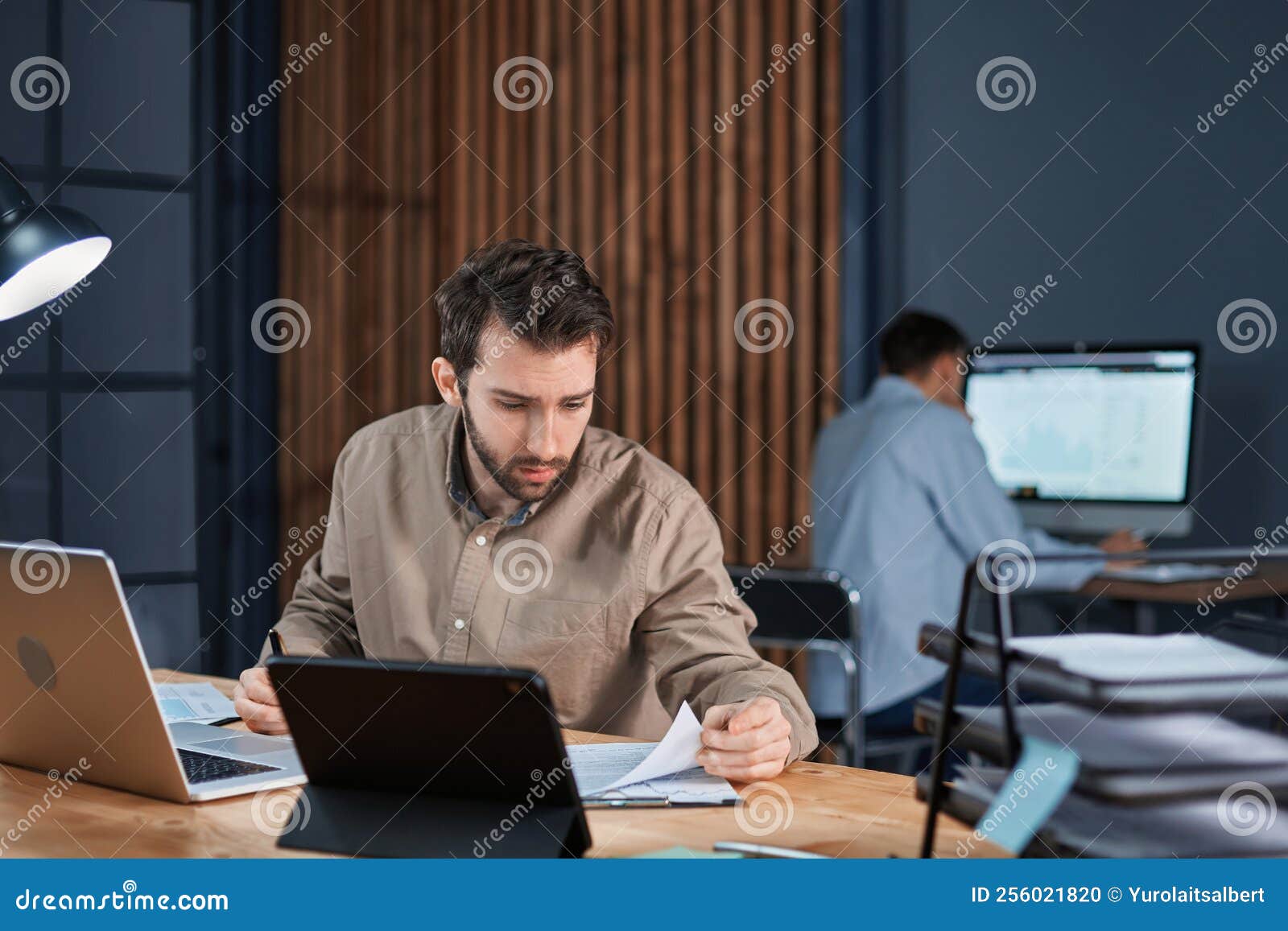 Employees Working in the Office until Late at Night. Stock Photo ...
