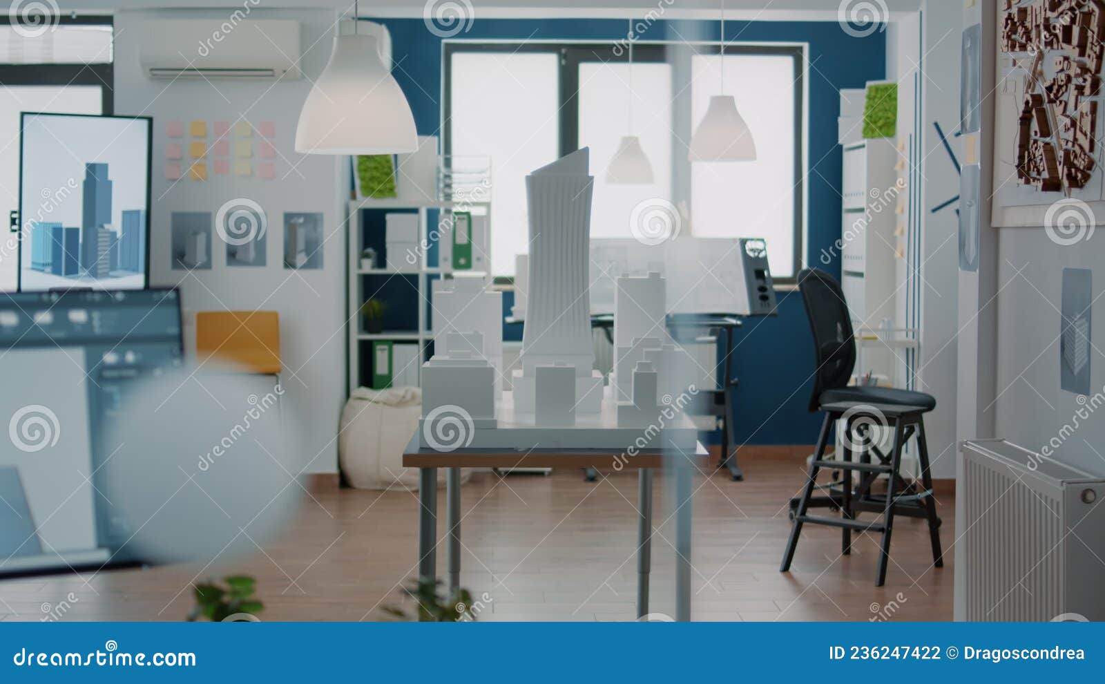 Empty Architectural Office with Building Model and Blueprints Plans on ...