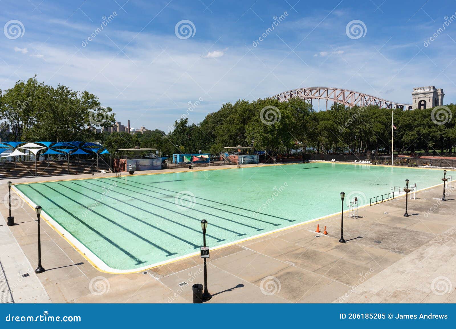 Empty Astoria Pool during Summer with the Hell Gate Bridge in the ...
