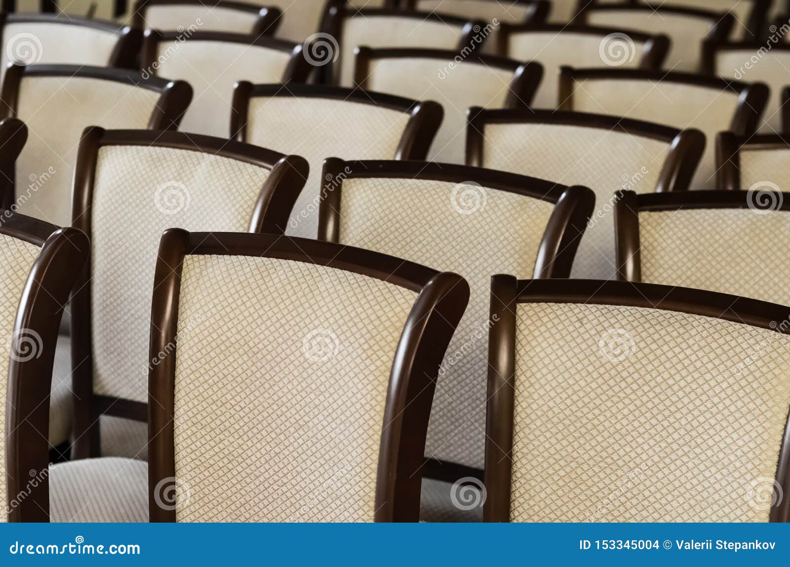 Empty Auditorium. White Chairs Spread Out in a Row. Empty Seats in the ...