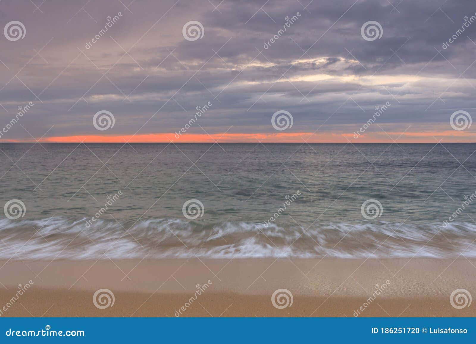 Empty beach at sunset stock photo. Image of cloudy, beautiful - 186251720