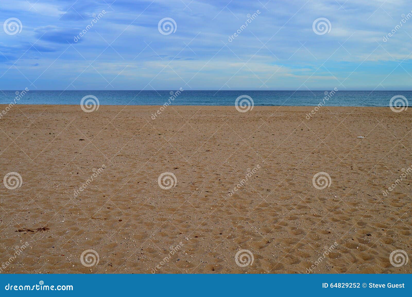 An Empty Beach and Sea stock photo. Image of vista, sand - 64829252