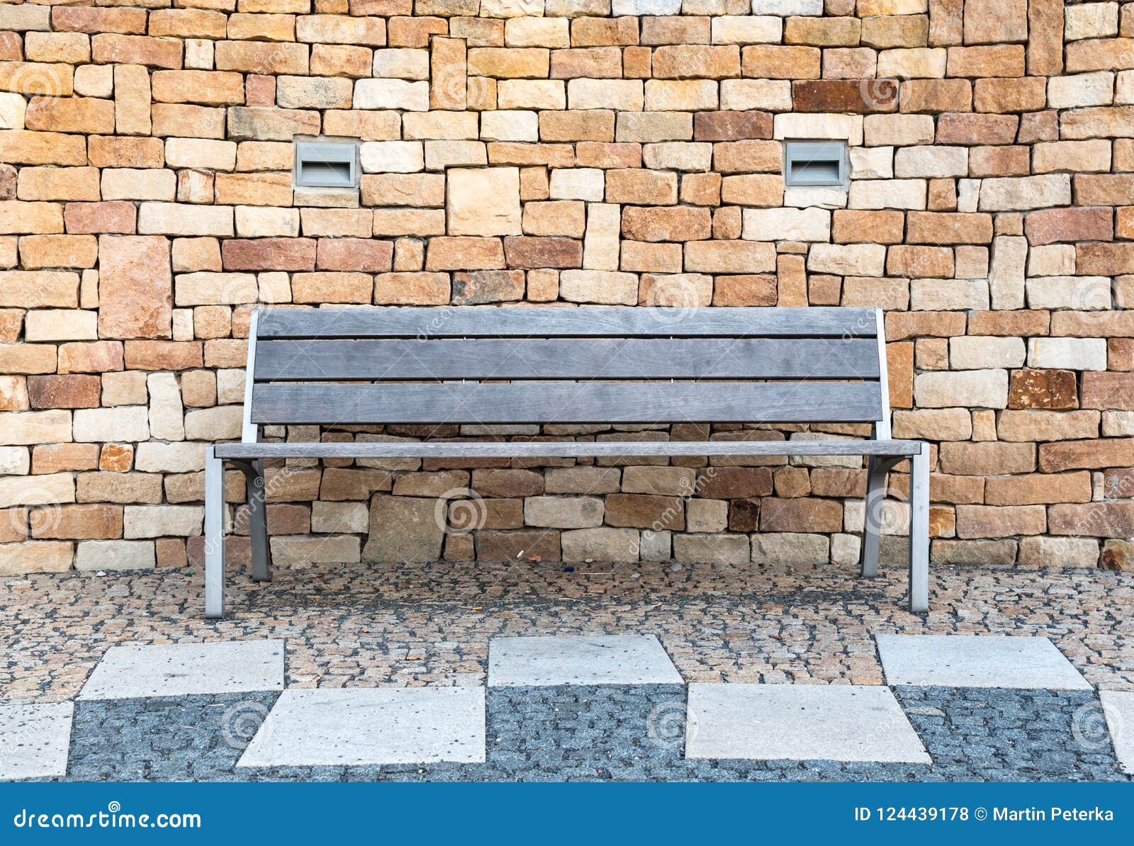 An Empty Bench in Front of a Stone Wall. Stock Photo - Image of brick ...
