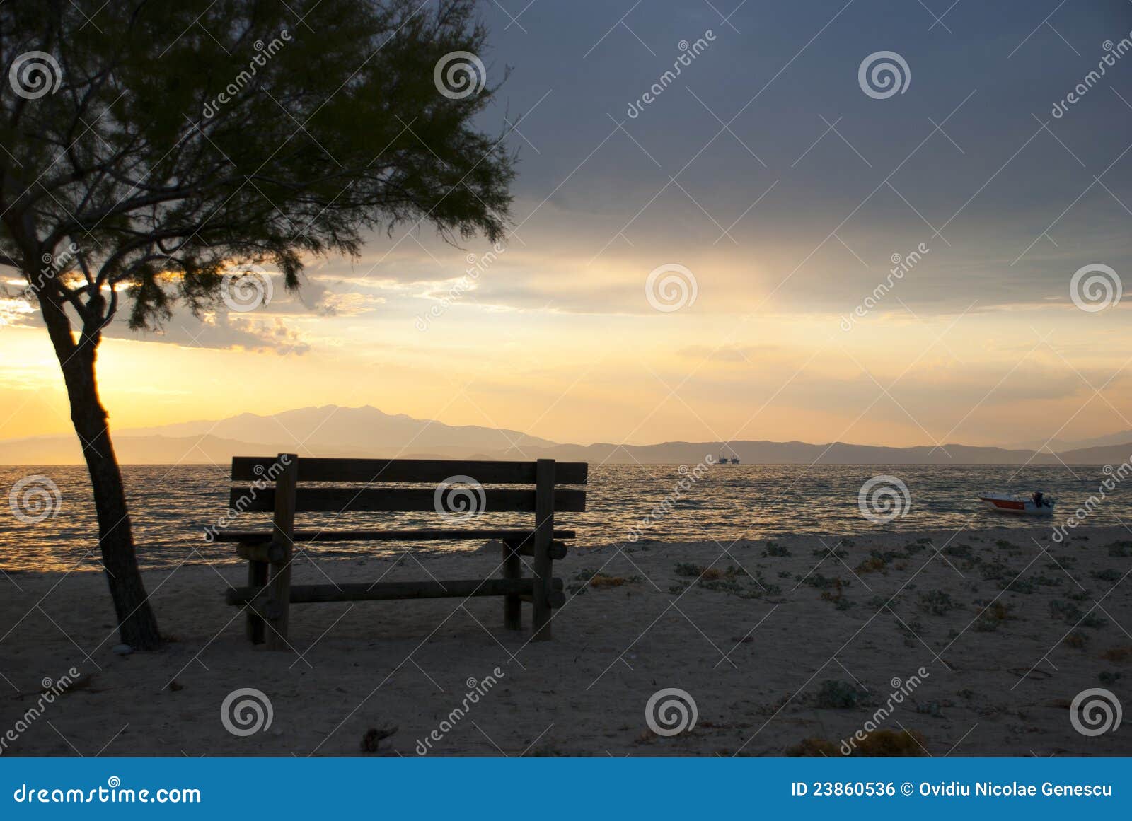 Empty bench looking at sea stock photo. Image of escape - 23860536