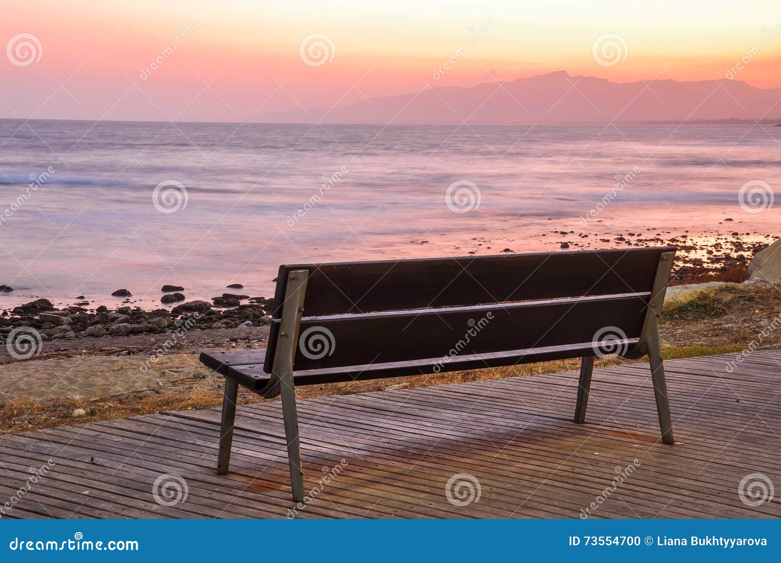Empty Bench beside the Sea at Sunset. Stock Photo - Image of purple ...