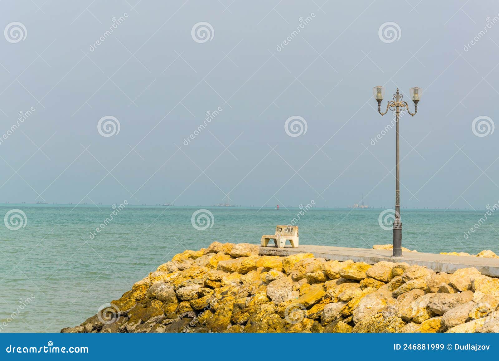 An Empty Bench and a Street Lamp on a Pier in Kuwait....IMAGE Stock ...