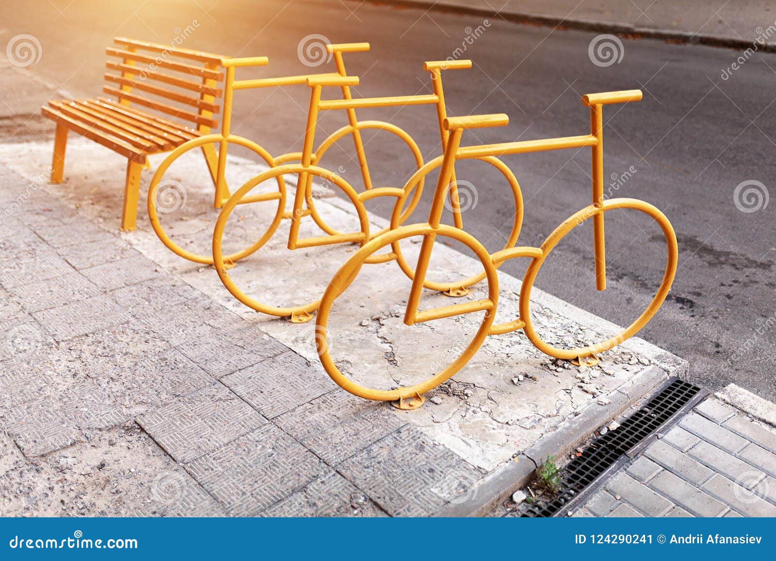 Empty Bicycle Parking City Park with Yellow Bench on the Background ...