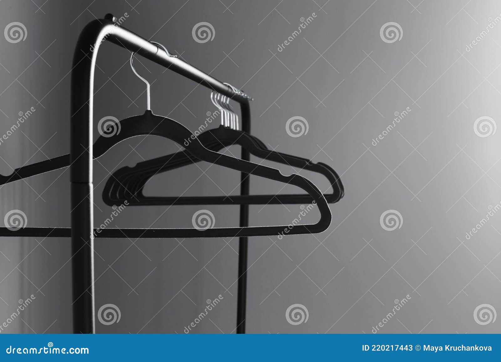 Empty Black Clothes Hanger on Gray Wall Background Stock Image - Image ...