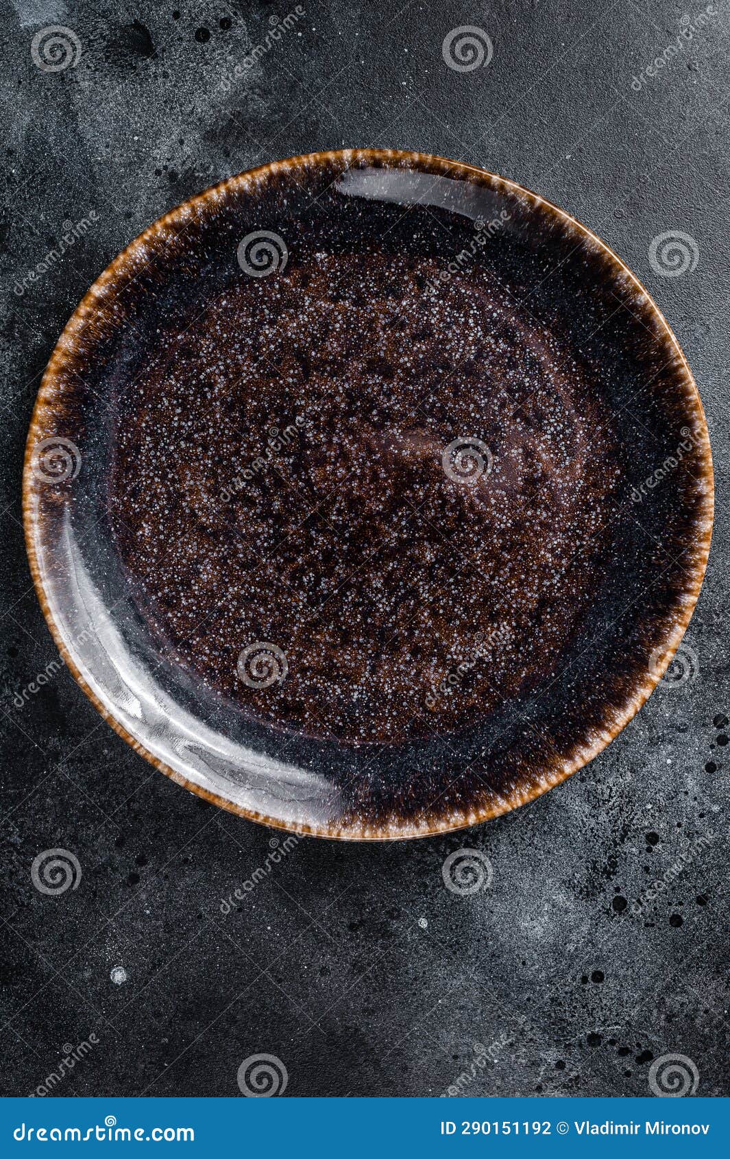 Empty Black Craft Plate on Table. Table Setting. Black Background. Top ...