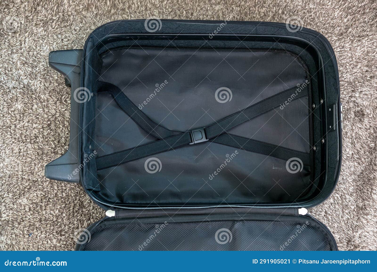 An Empty Black Suitcase Lay on the Floor, Waiting To Be Loaded Stock ...