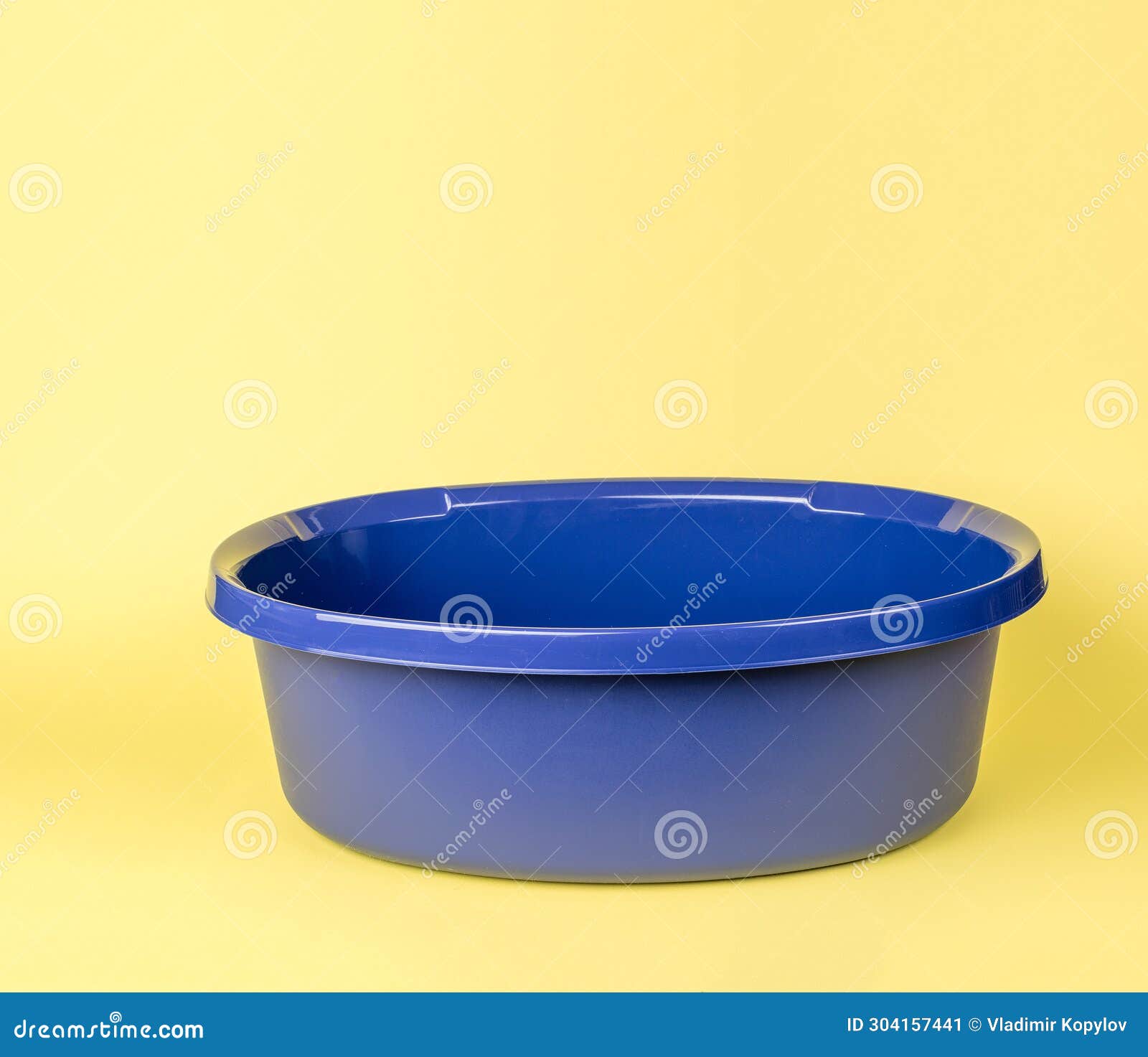 An Empty Blue Basin on a Yellow Background Stock Image - Image of ...