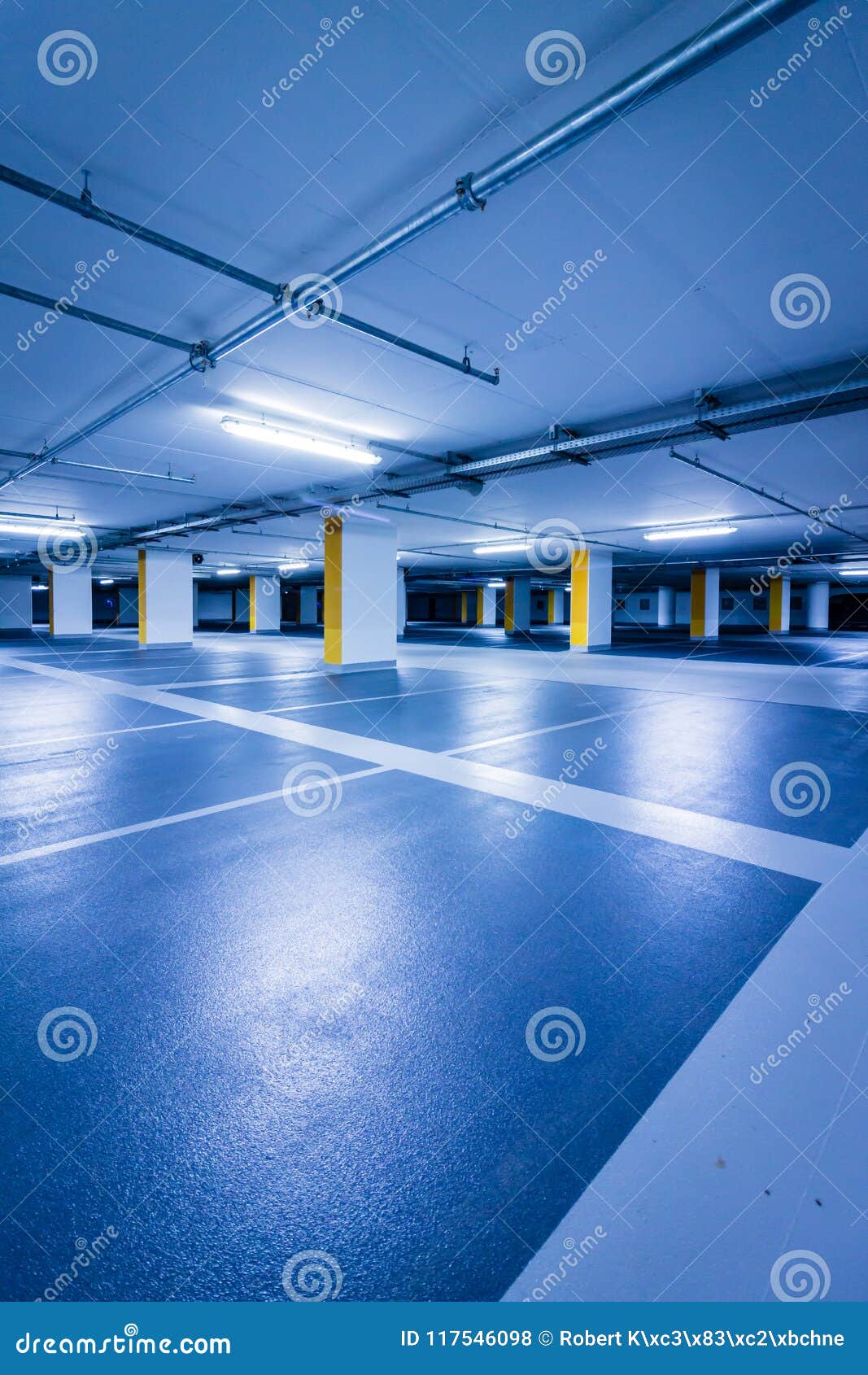Empty Blue Parking Garage with Yellow Columns Stock Photo - Image of ...