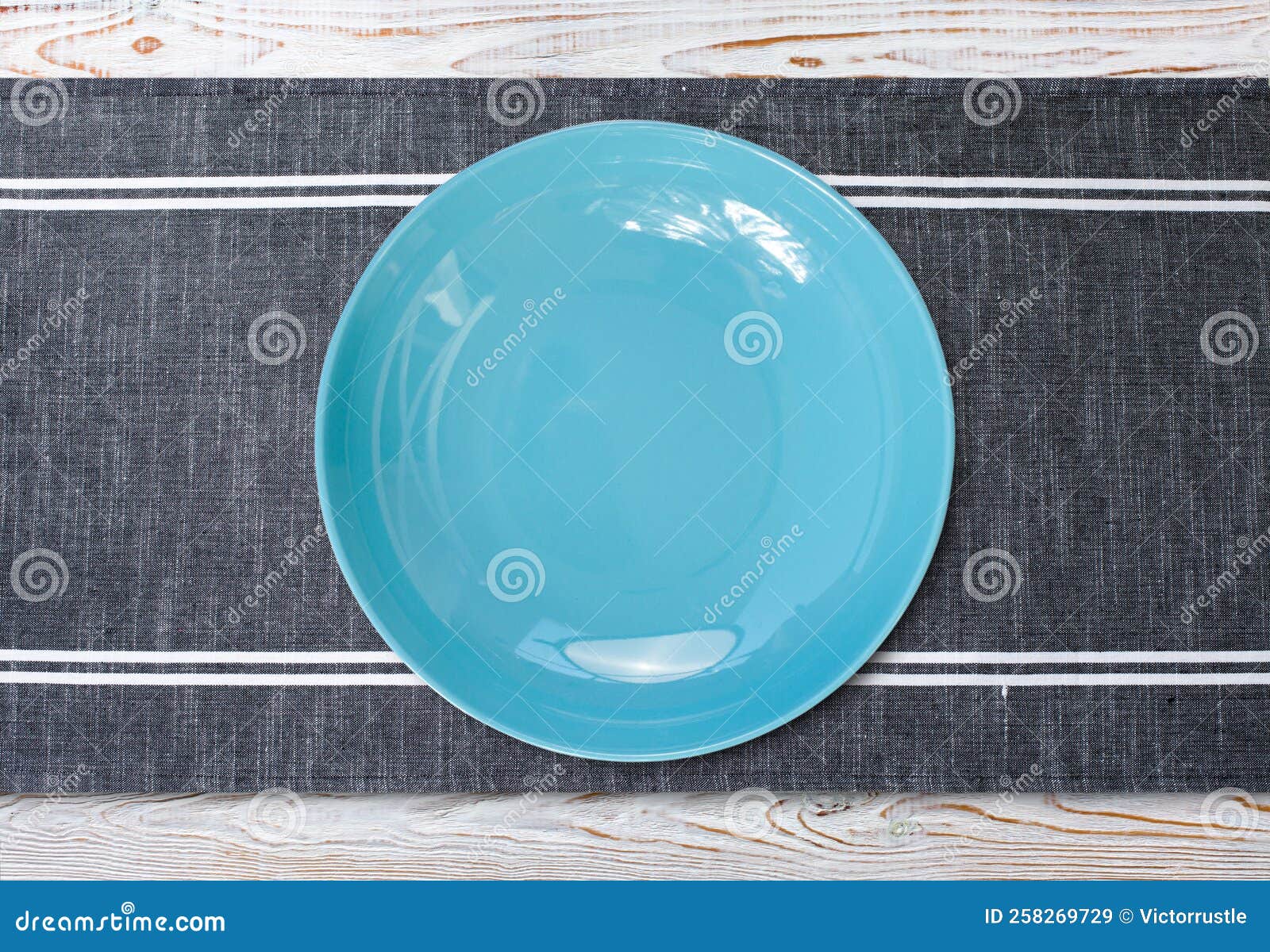 Empty Blue Plate and Tablecloth on Wooden Desk, Flat Lay Stock Image ...