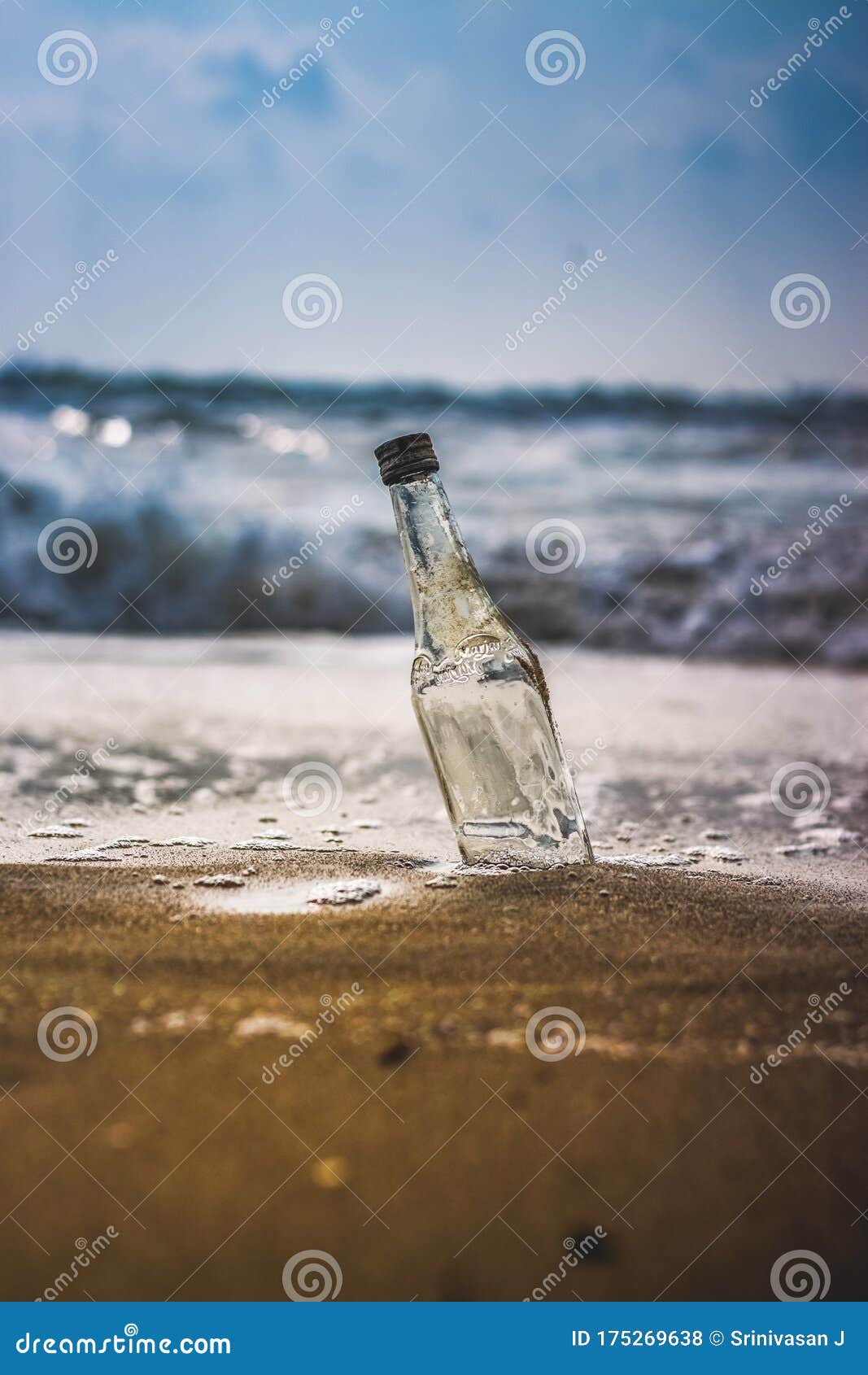 Empty Bottle on the Beach stock photo. Image of sand - 175269638