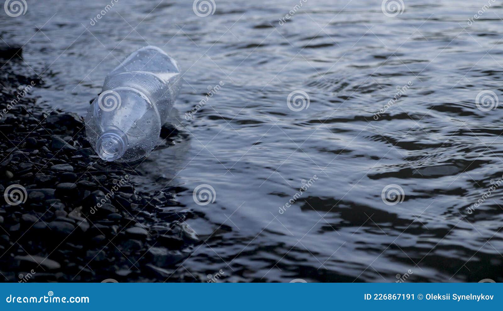 Empty Bottle Plastic Trash Lying on the River Shore Water Waste. Thrown ...