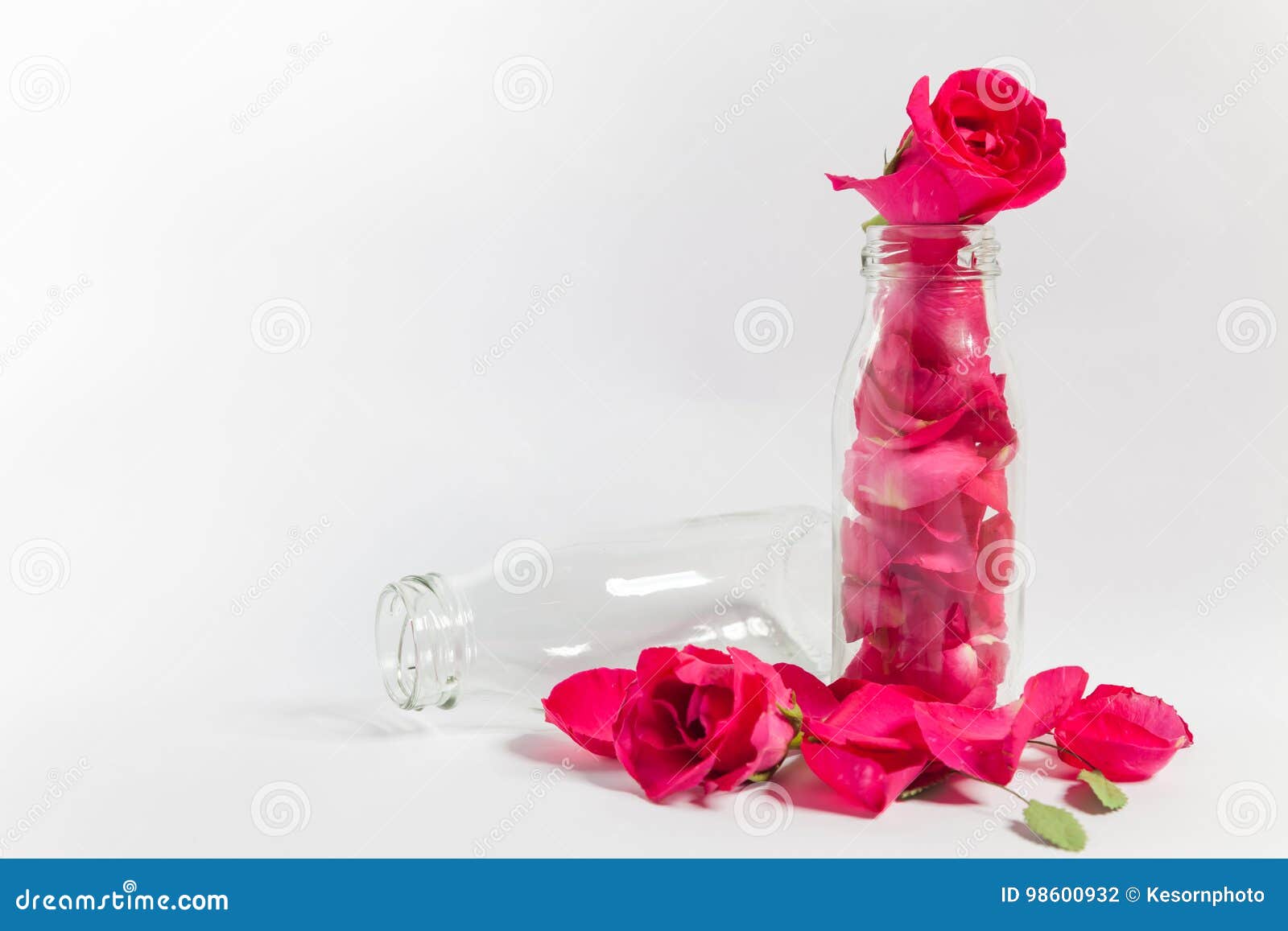 Empty Bottles and Rose Petals Stock Photo - Image of love, shape: 98600932