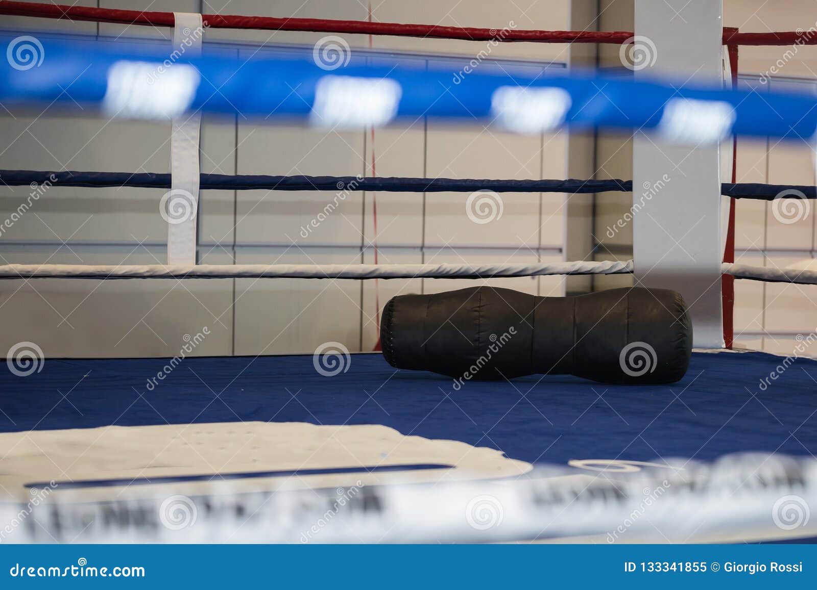 Empty Boxing Ring with Black Punching Bag on the Ground Stock Image ...