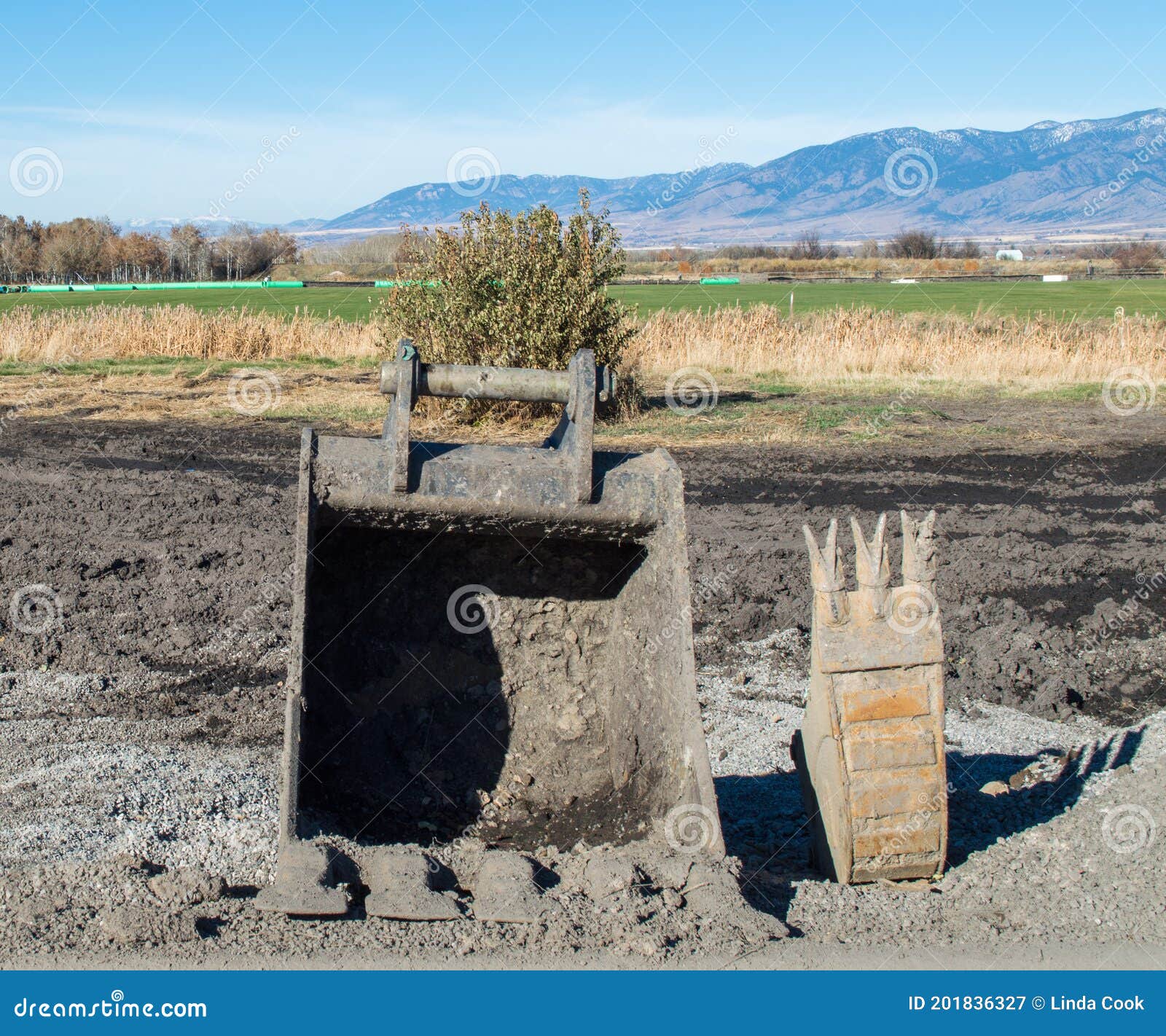 2 Empty Bulldozer Buckets at a Construction Site Stock Image - Image of ...