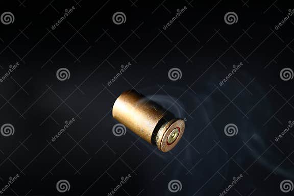 Empty Bullet Shell Casings, on a Black Background, Smoke Stock Photo ...