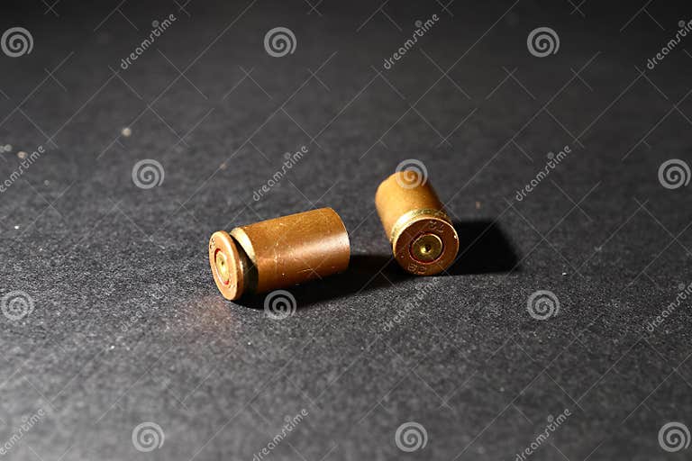 Empty Bullet Shell Casings, on a Black Background, Smoke Stock Photo ...