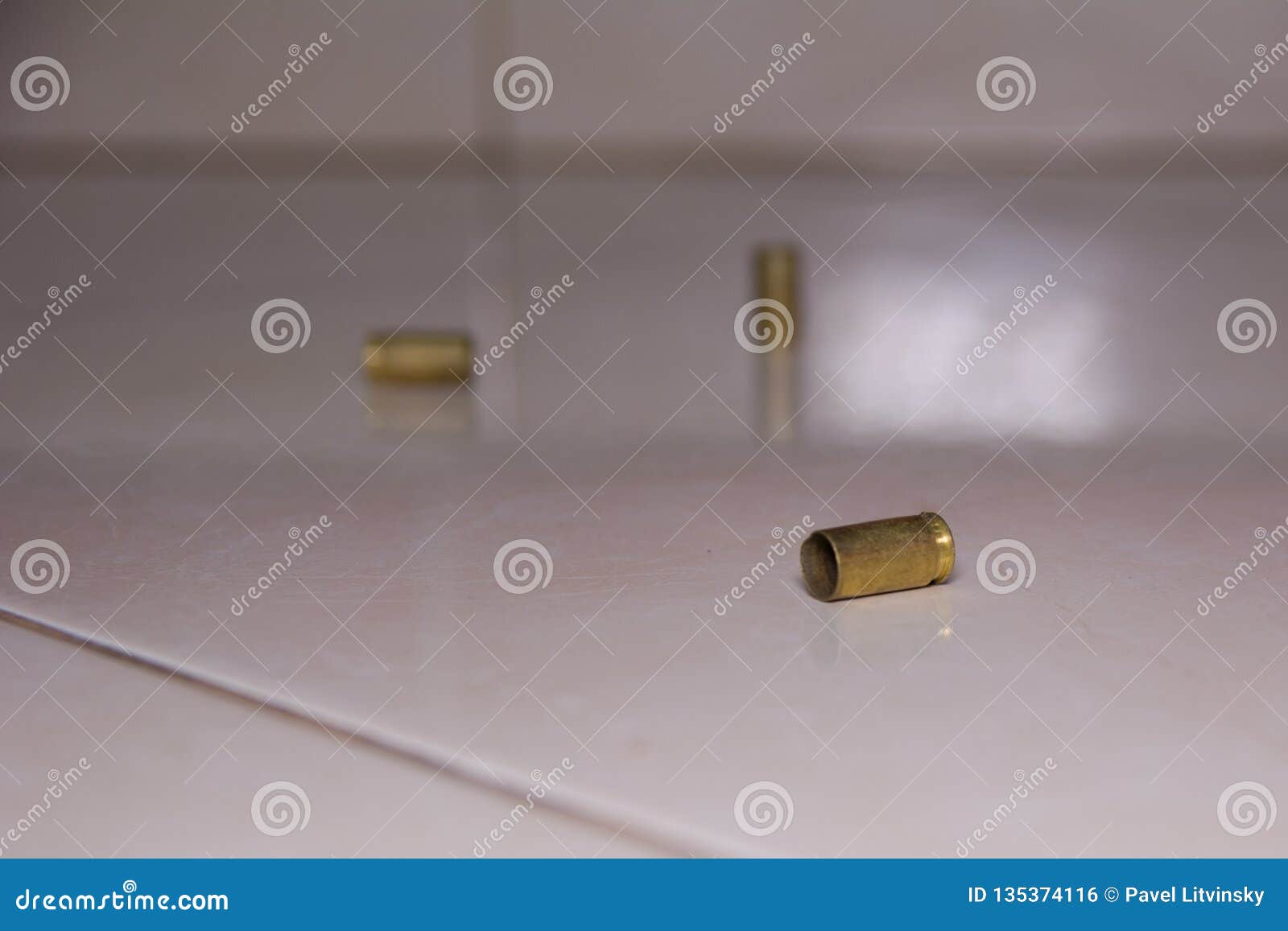 Empty Bullet Shells on the House Floor. Bullet Casings on the Ceramic ...