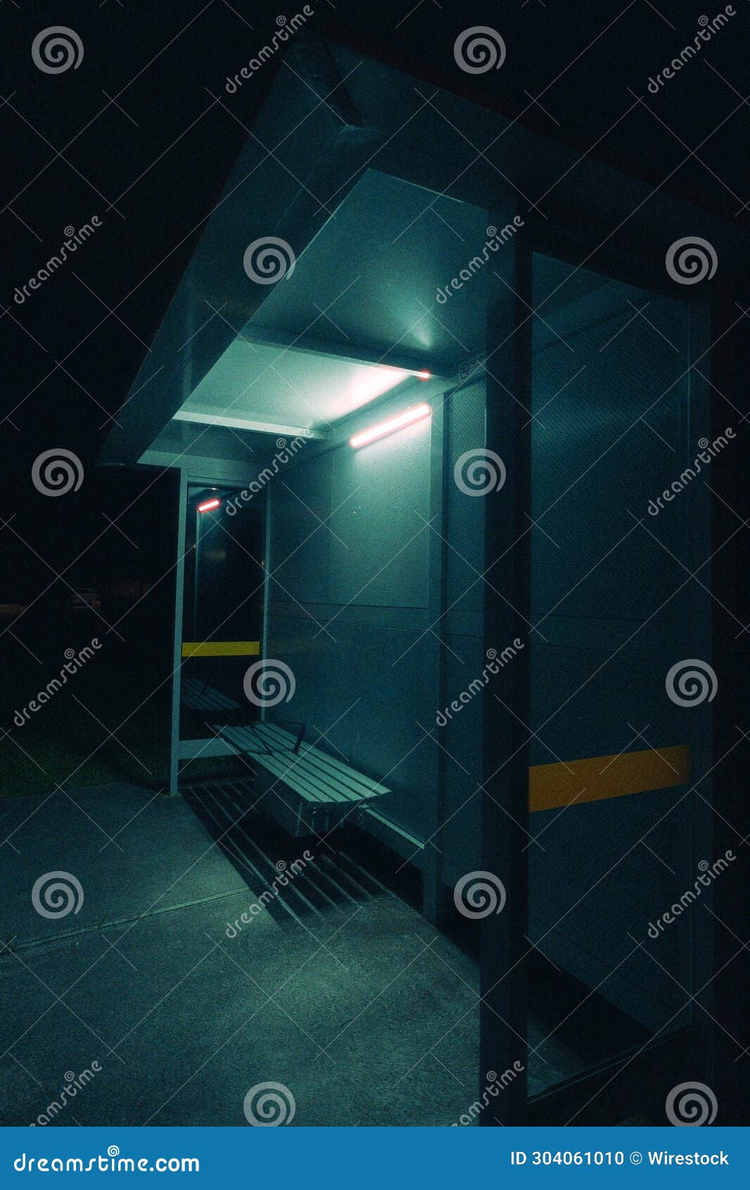 An Empty Bus Stop at Night with the Lights on and Light on Stock Photo ...