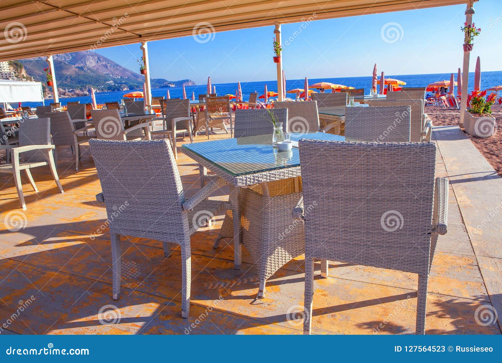 Terrace on the beach stock image. Image of business - 127564523