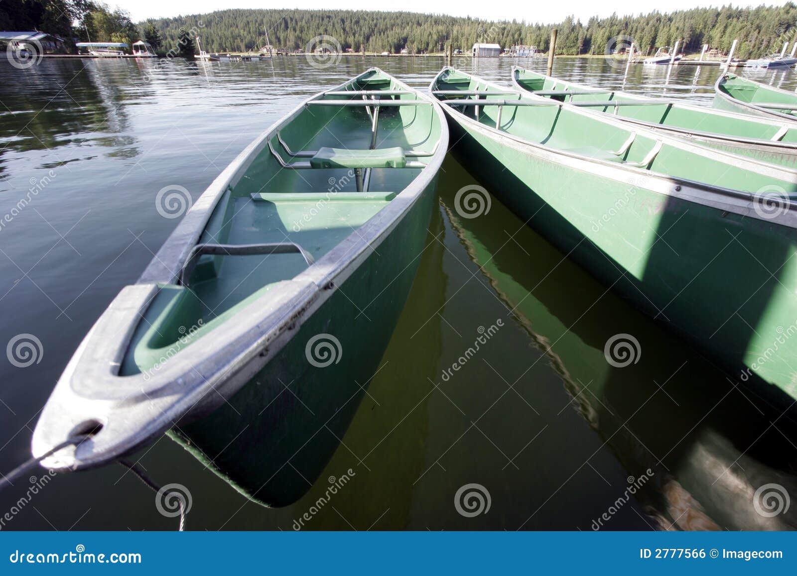 Empty canoes on the water stock photo. Image of lake, boat - 2777566