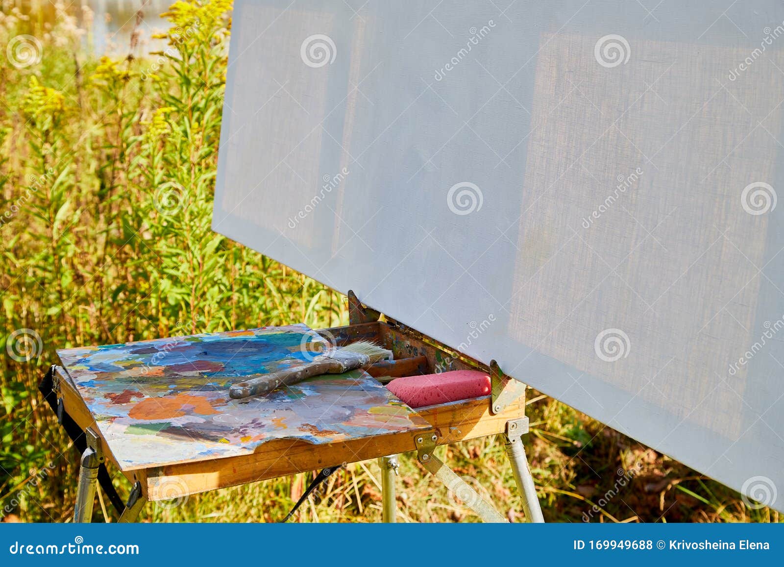 An Empty Canvas on Easel Outdoors. the Work of the Artist Stock Photo ...