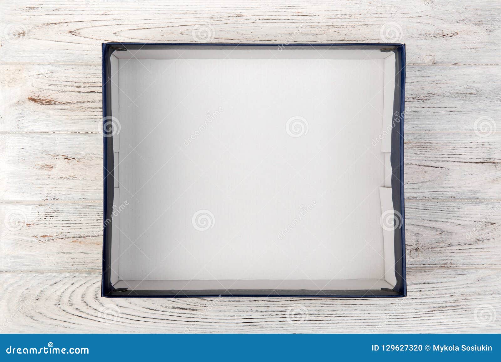 Empty Cardboard Blue Blank Box on White Wooden Background. Top View ...
